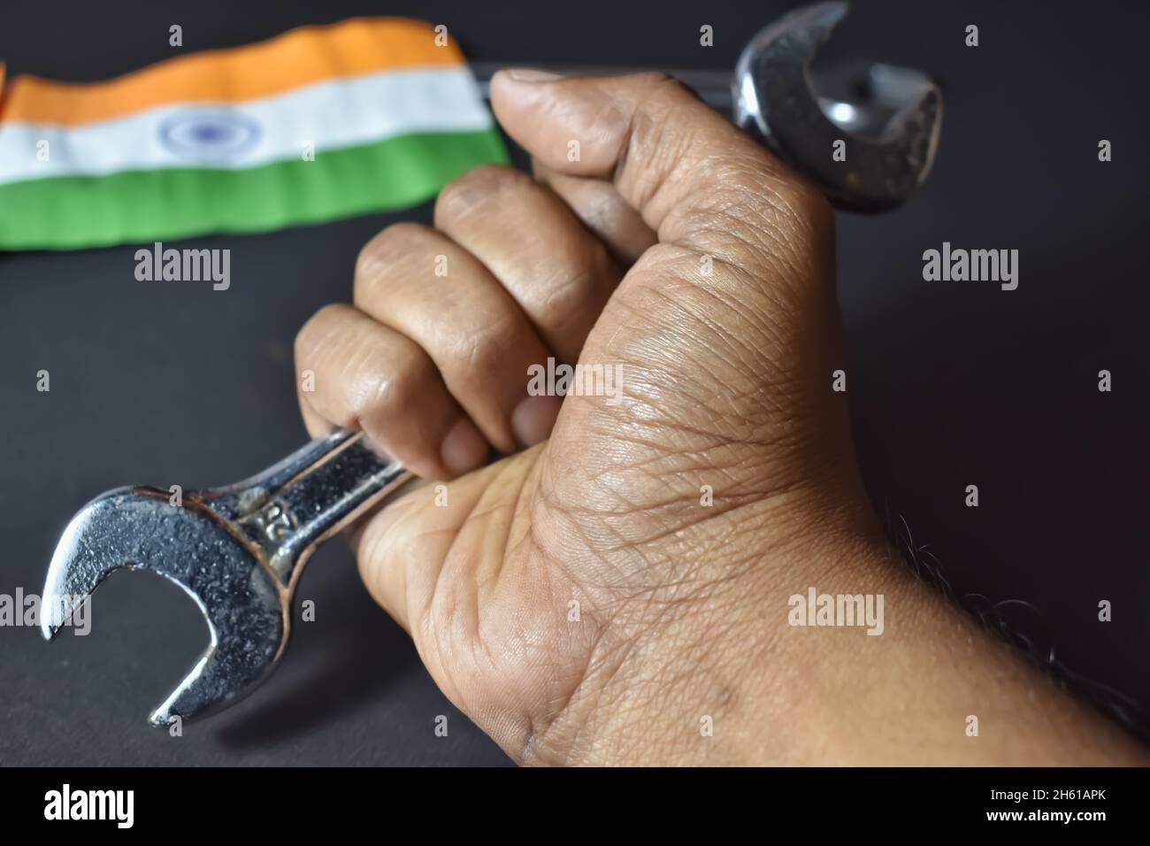 Selective focus photo of labor holding industrial spanner in hand ...