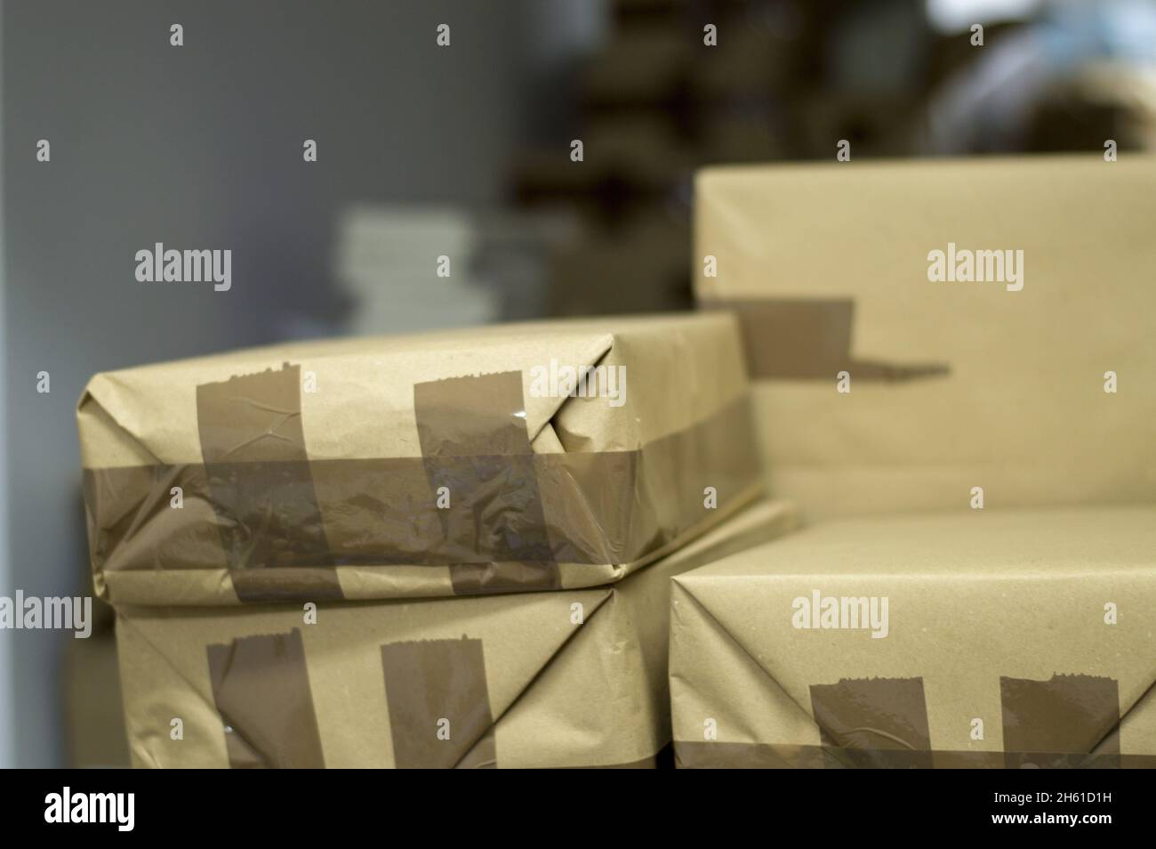 Close up shot of a parcel boxes made of craft paper with brown duct ...