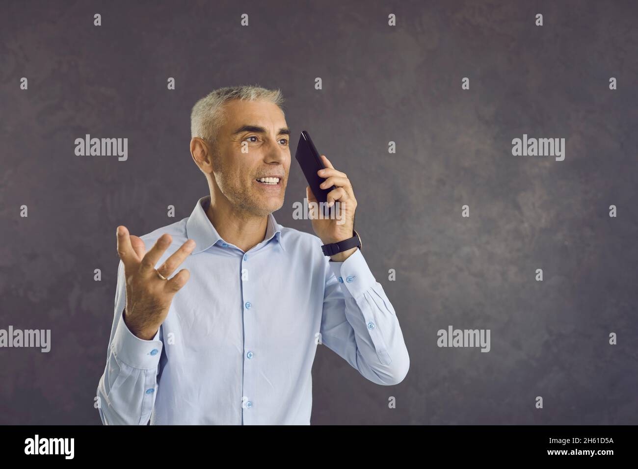 Successful middle-aged man talk on smartphone call Stock Photo - Alamy
