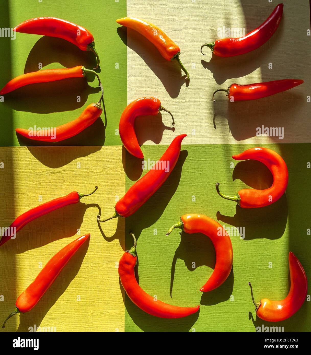 Flat lay Red fresh hot chili peppers on paper background Stock Photo ...