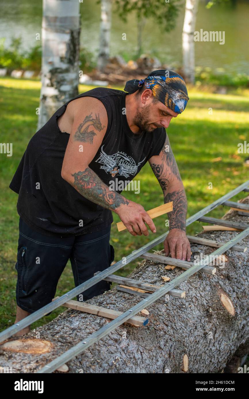 Old man cutting log hi-res stock photography and images - Alamy