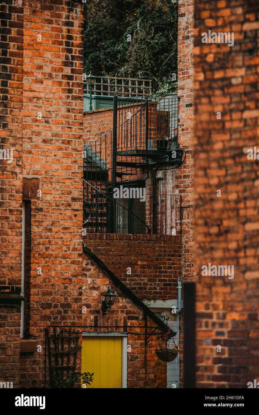 Vertical shot of the orange brick buildings Stock Photo - Alamy