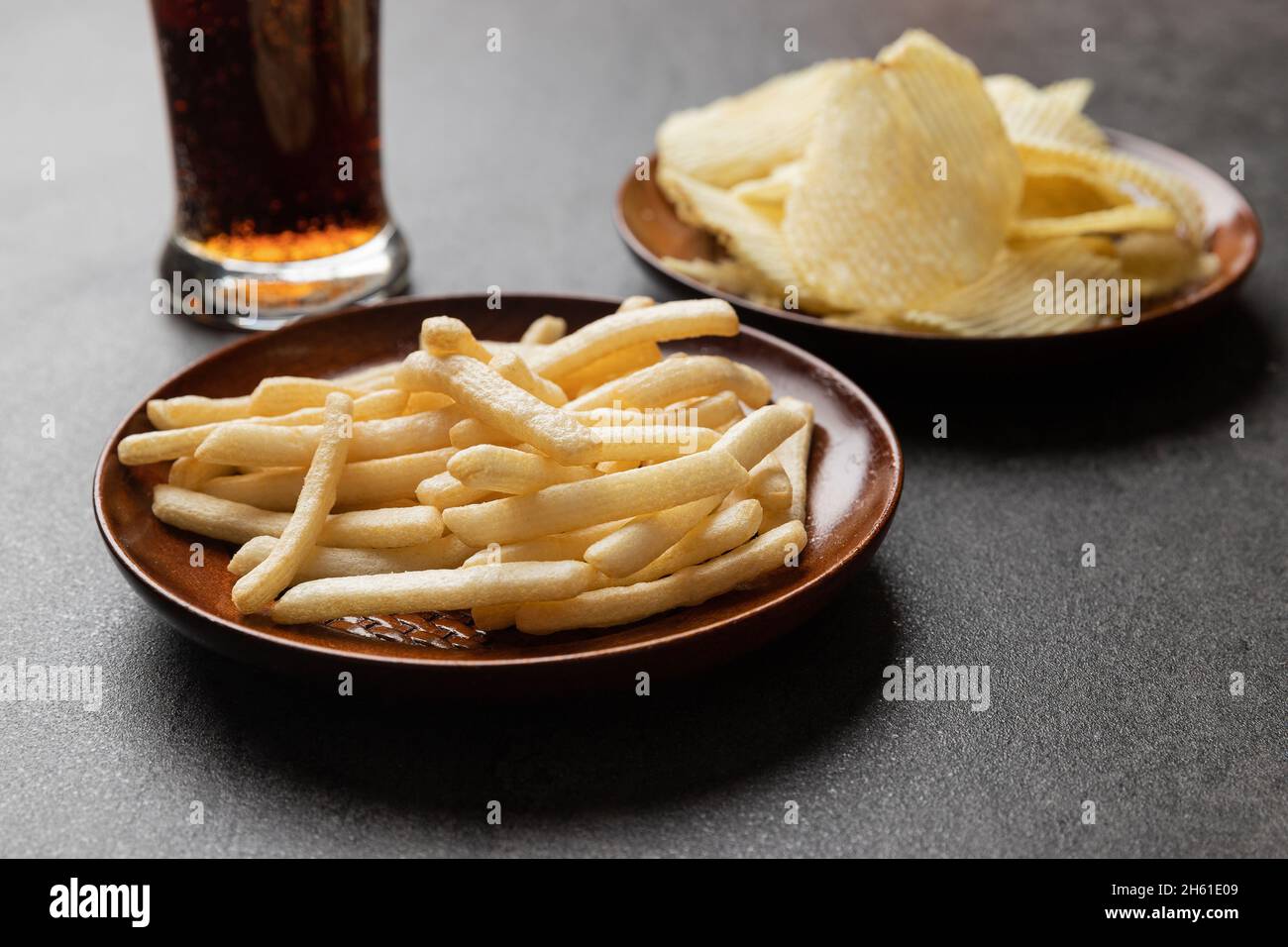French fries snack, Potato chips and a glass of cola. Food and drink ...