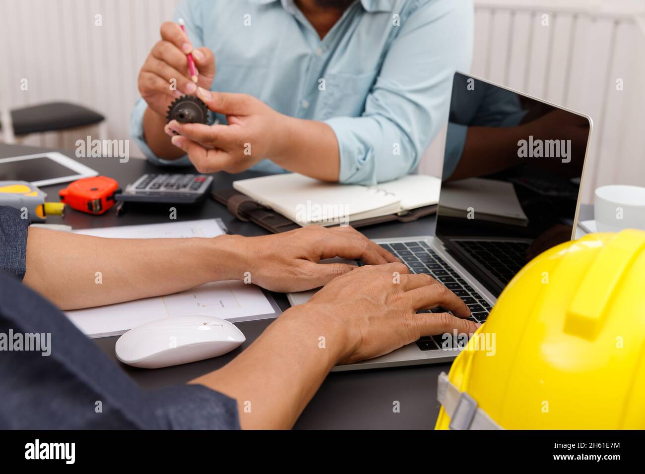 The engineering team is working on their project together Stock Photo ...