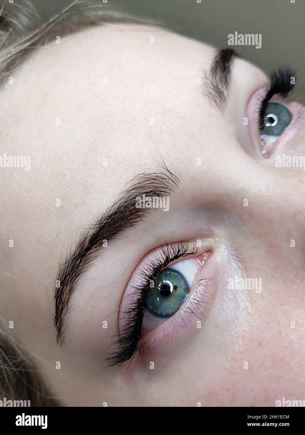 Lash extensions in beauty salon macro eye top view Stock Photo - Alamy