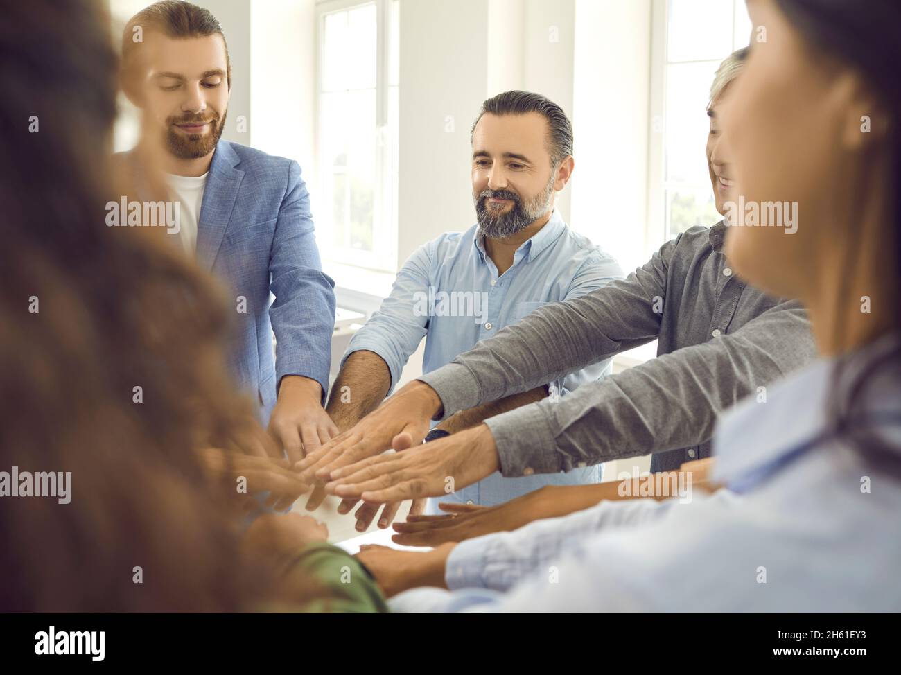 Office hand together hi-res stock photography and images - Alamy