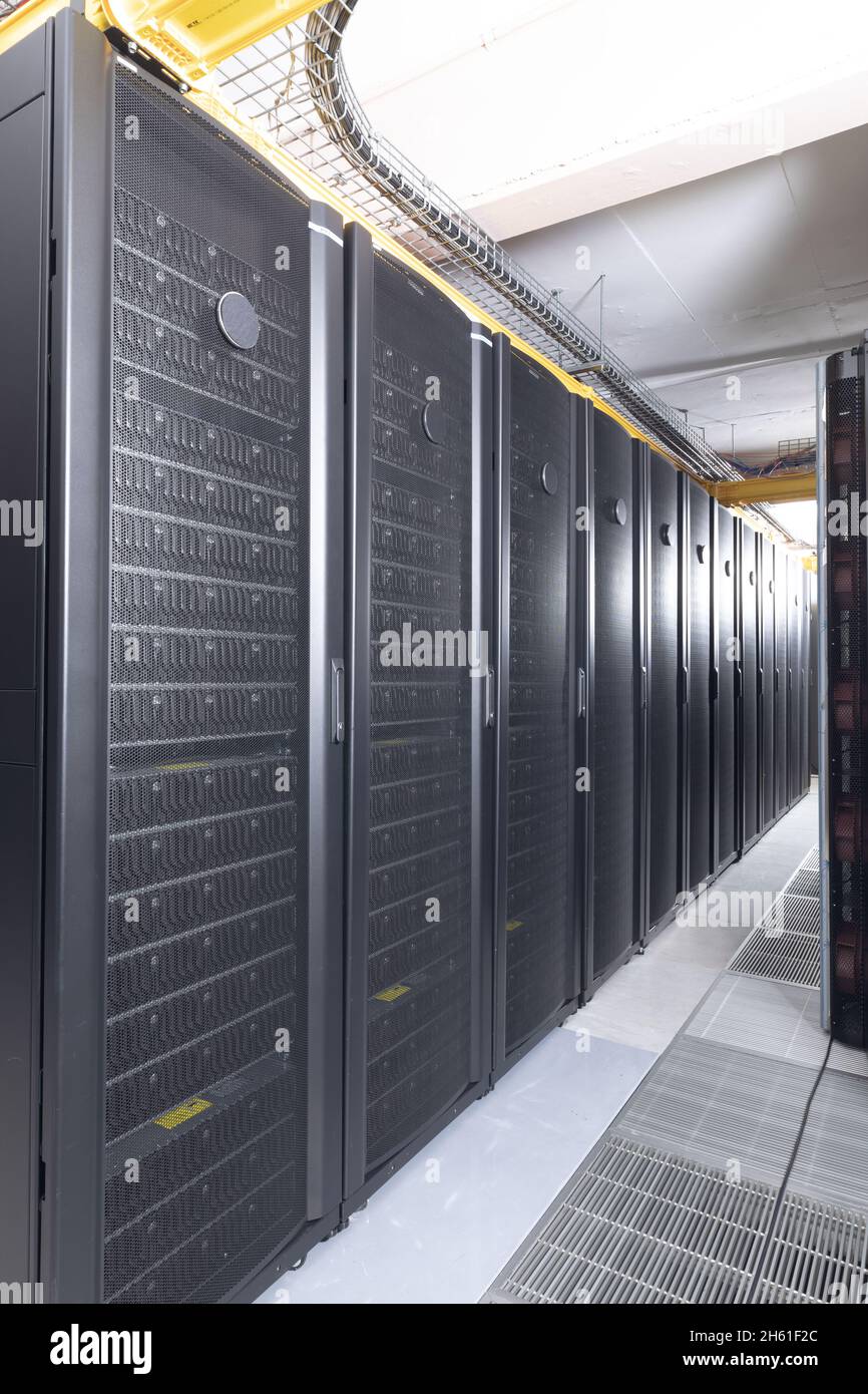 Data center with multiple rows of fully operational server racks Stock ...