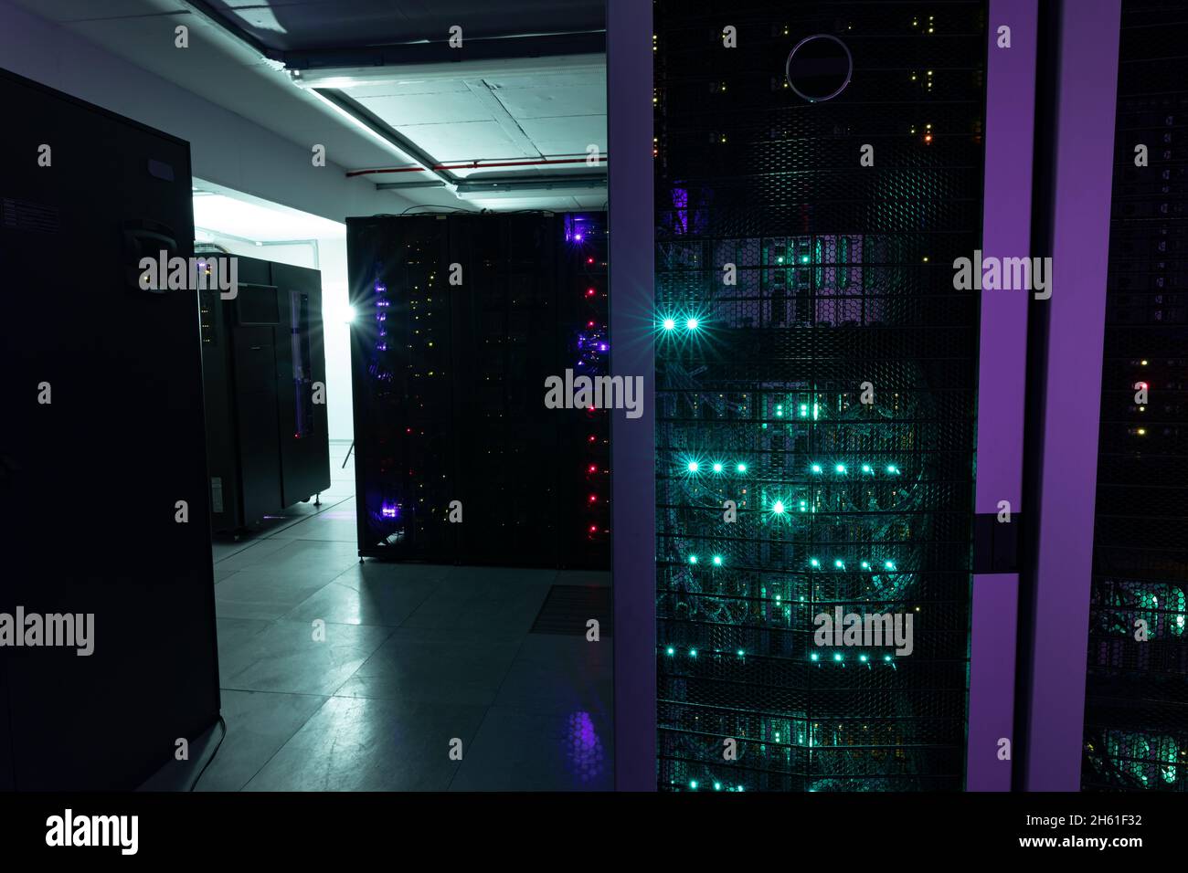 Data center with multiple rows of fully operational server racks Stock ...