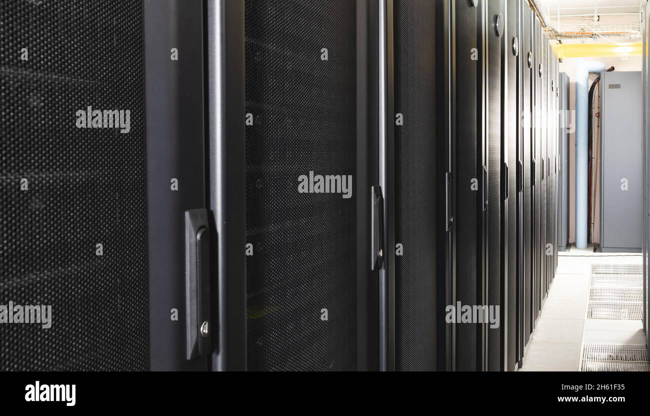 Data center with multiple rows of fully operational server racks Stock ...