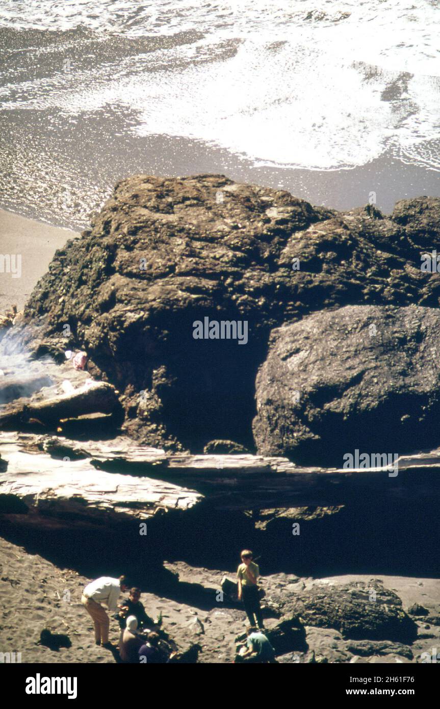 1970s America: Family enjoying a picnic on a beach near Trinidad ...
