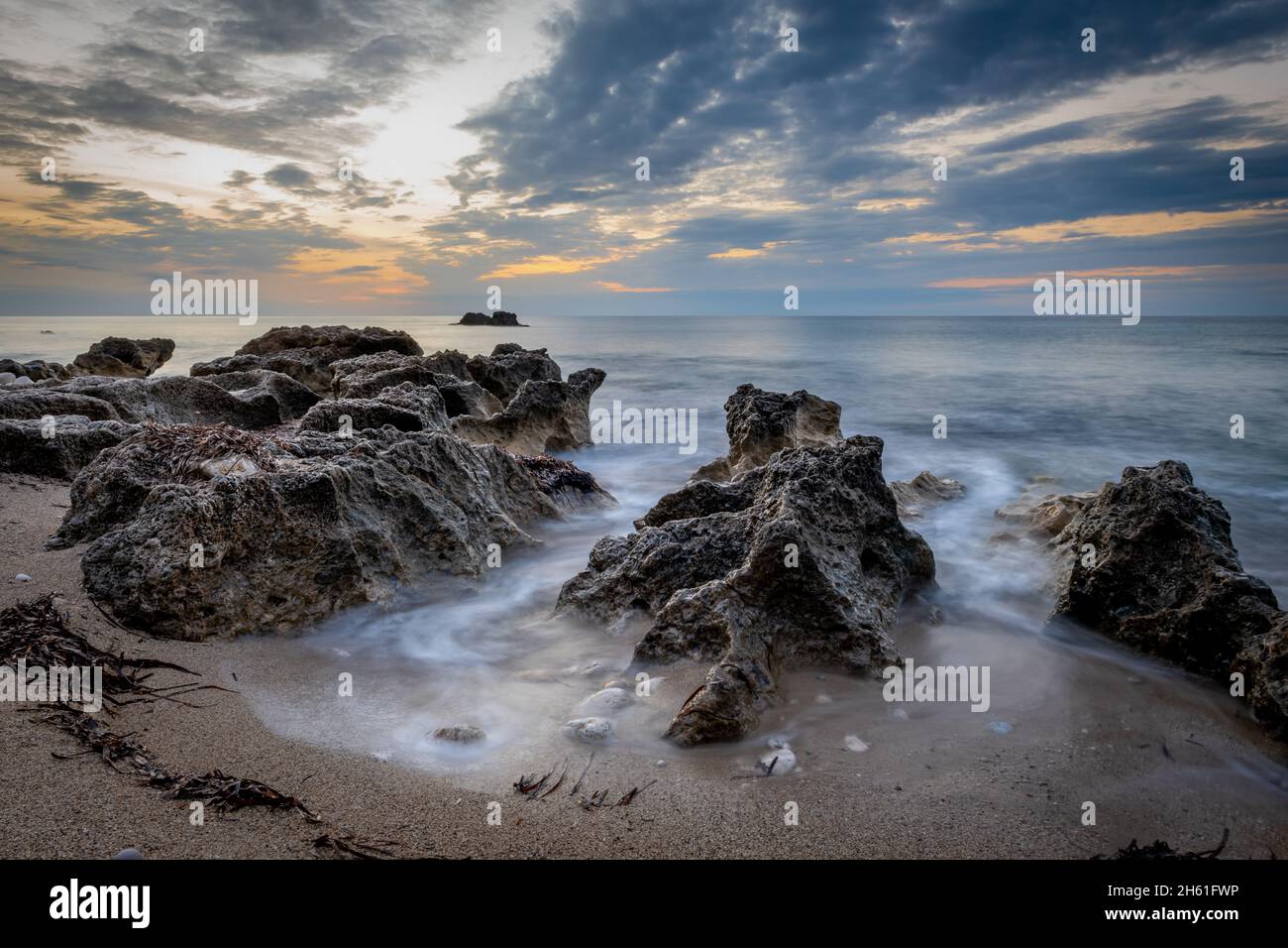 Long exposure capture of a beach sunset Stock Photo - Alamy