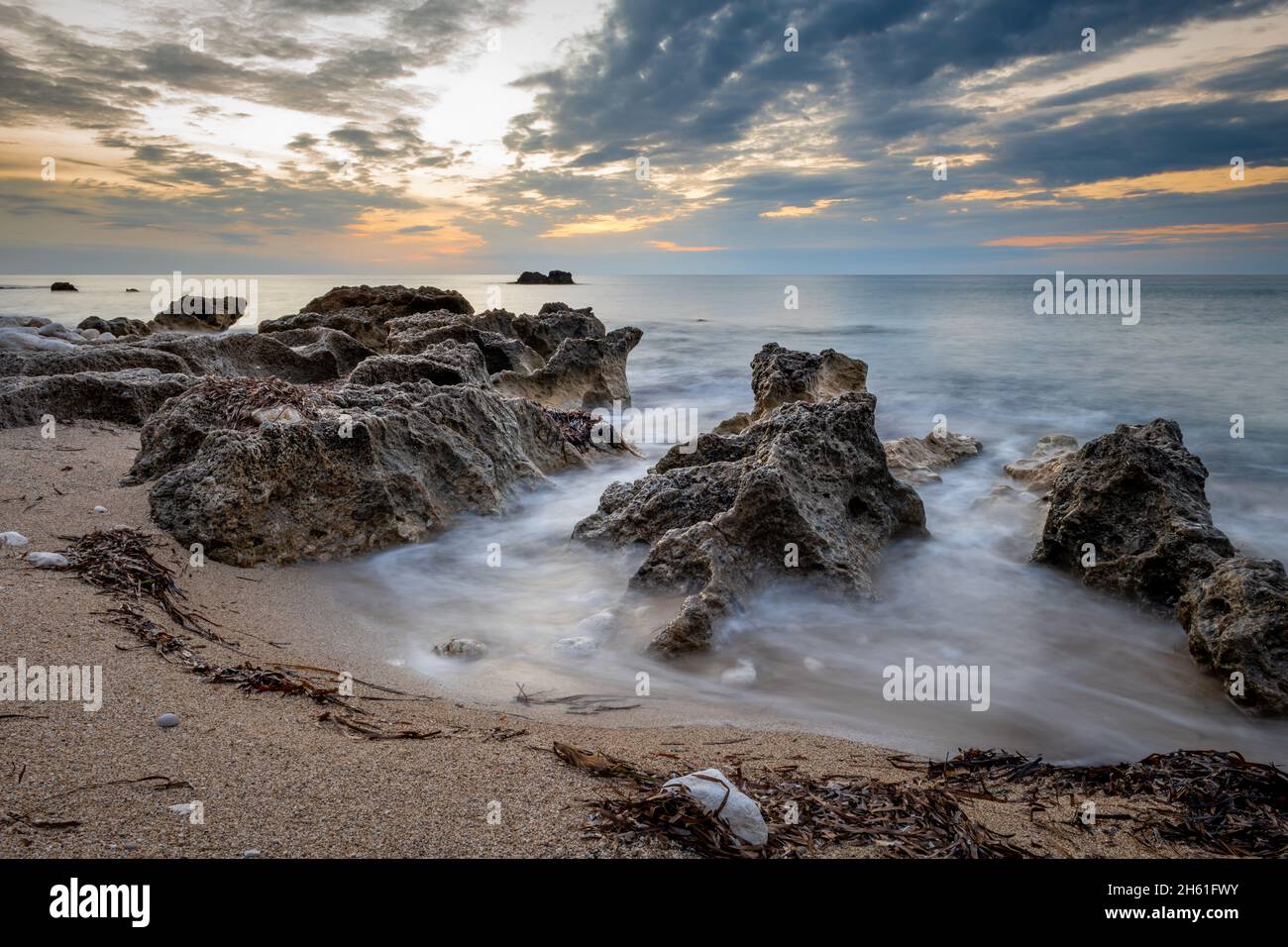 Long exposure capture of a beach sunset Stock Photo - Alamy
