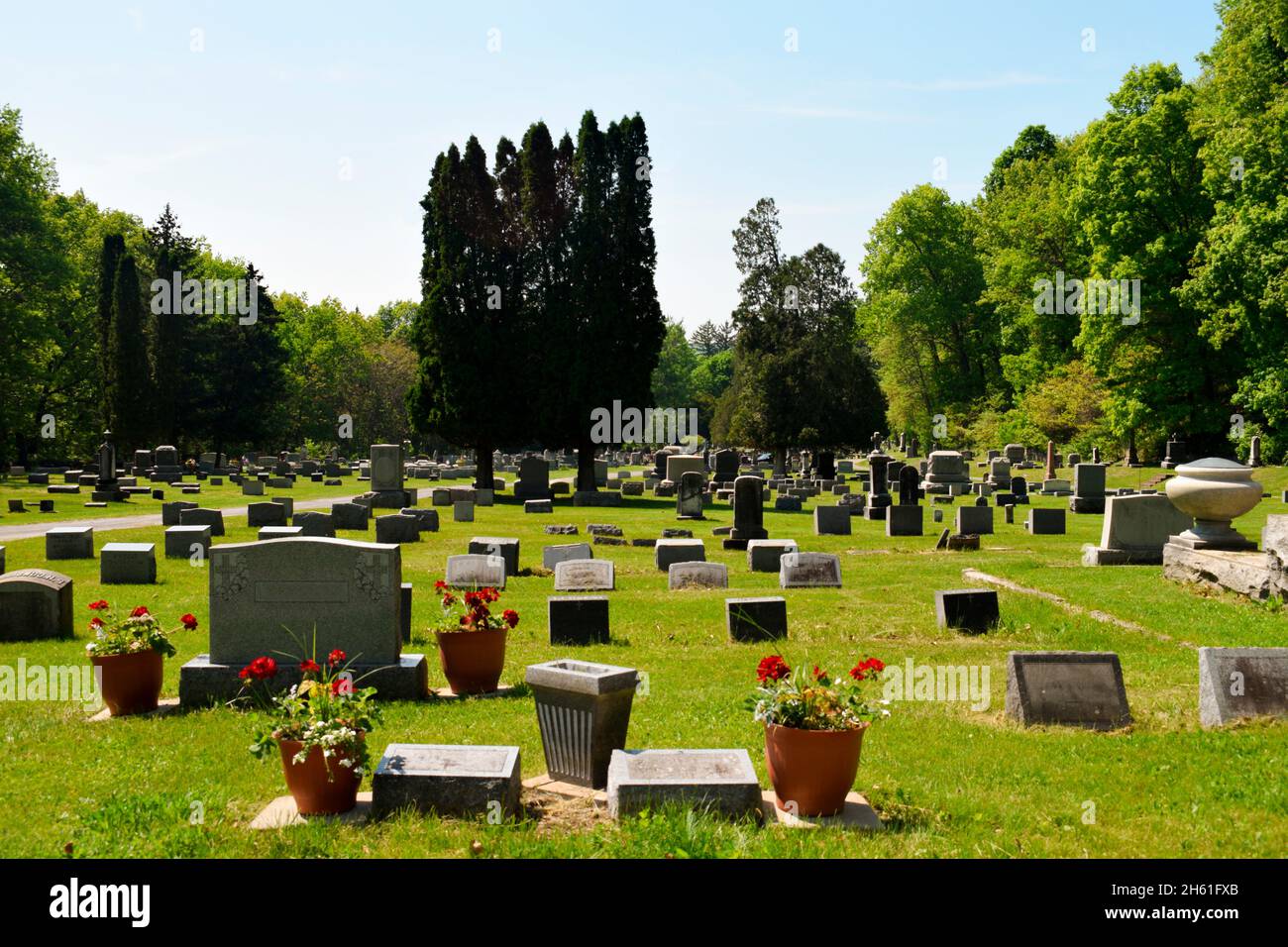 Catholic cemetery with tombstones and crosses in sunny day with ...