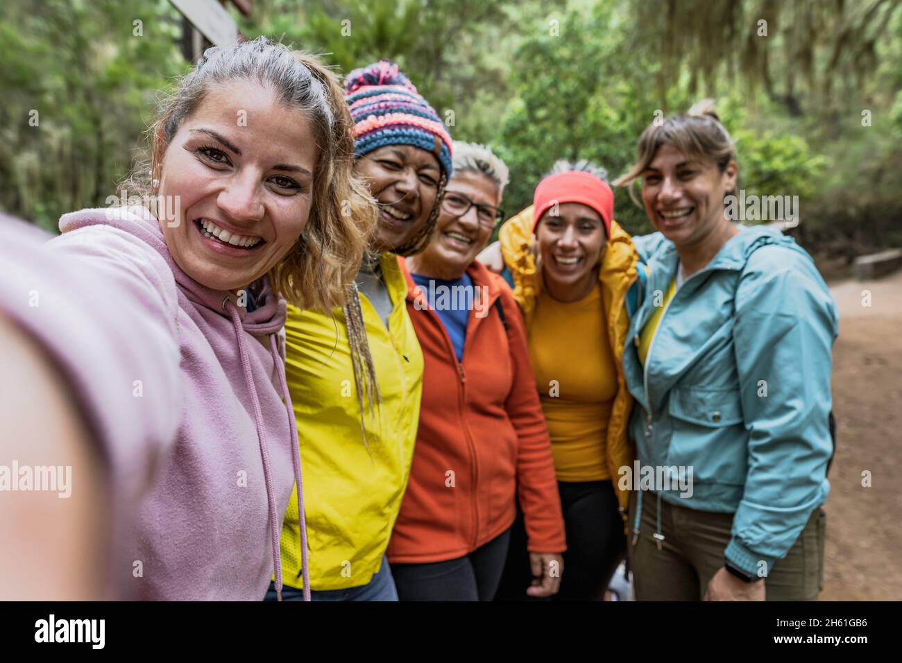Group of women with different ages and ethnicities having fun taking ...