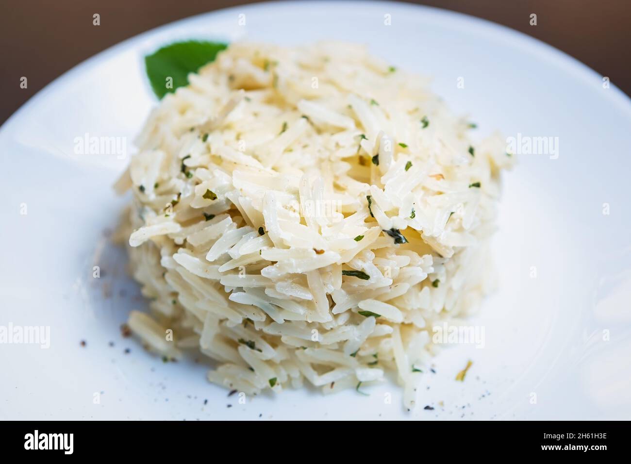 Boiled white rice on plate in Asian restaurant Stock Photo - Alamy