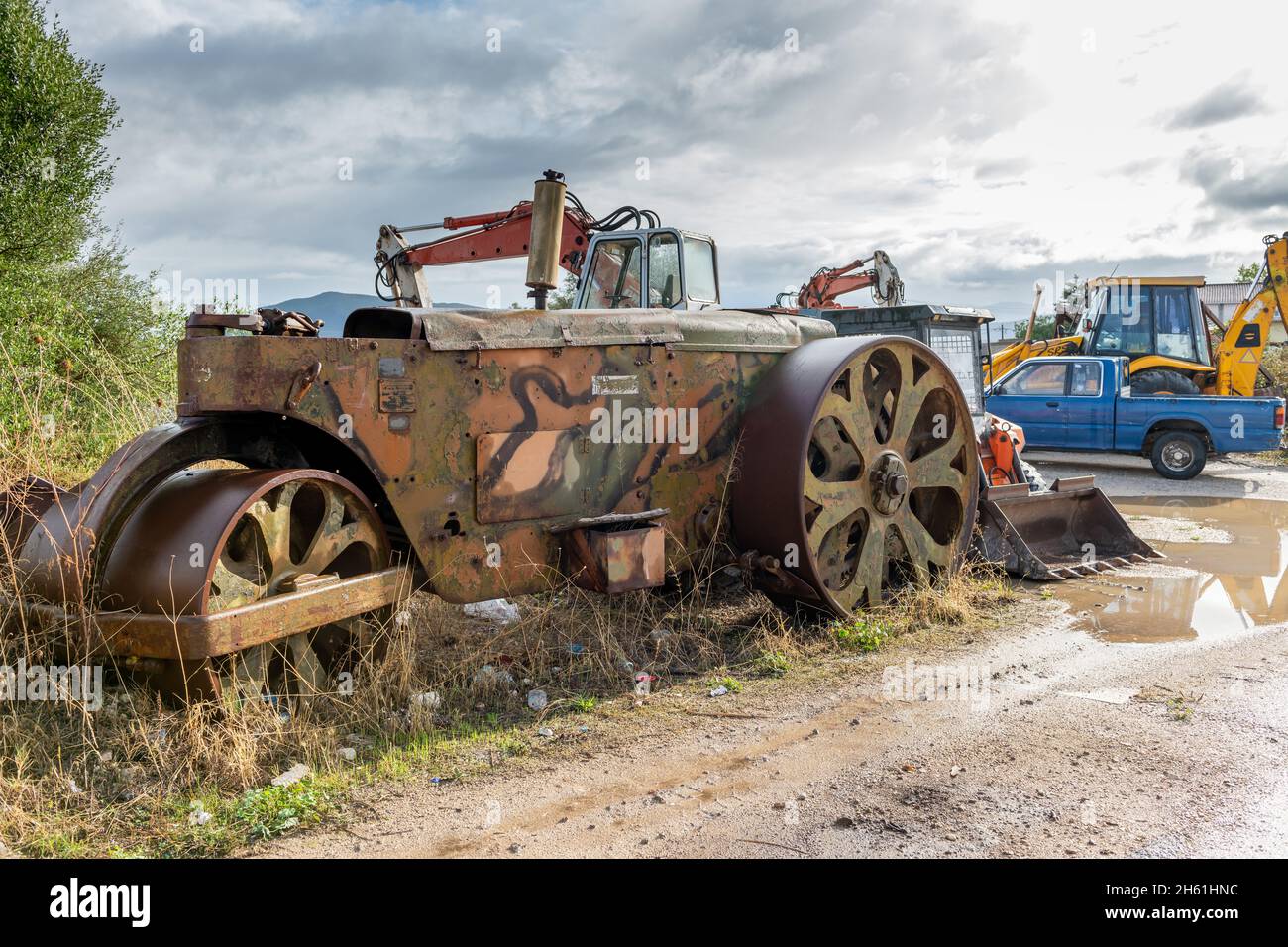New and old heavy construction machinery on a building site Stock Photo ...