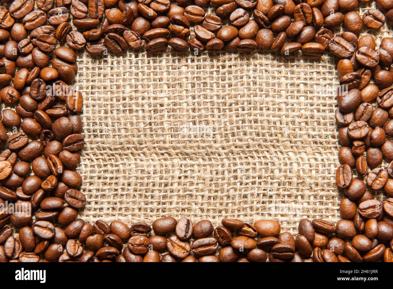 Format-filling view of a rectangular frame made of roasted coffee beans ...