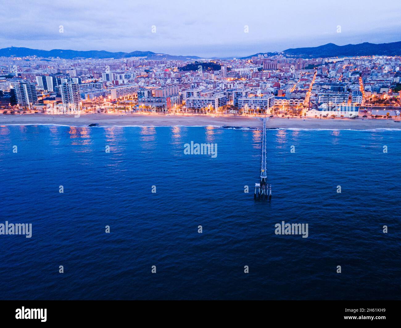 Beautiful shot of a long pier and observation deck on the beach in ...