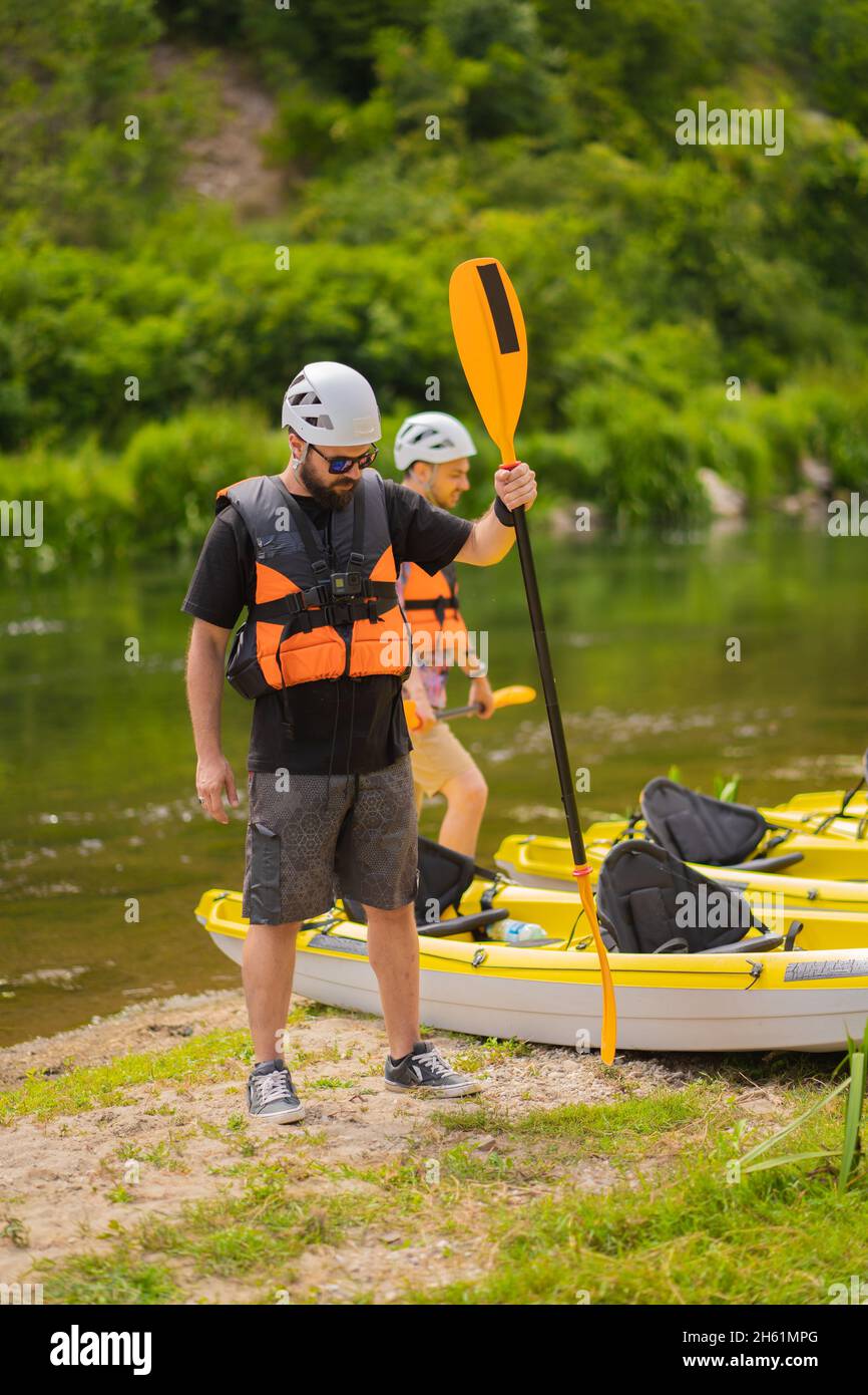 Portrait of male adult getting ready to kayaking with his friends Stock ...