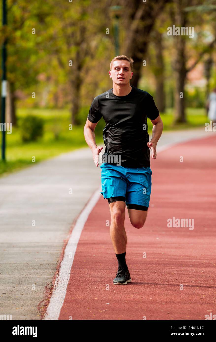 Running fitness sport man Male runner sprinting on road - fit muscular ...