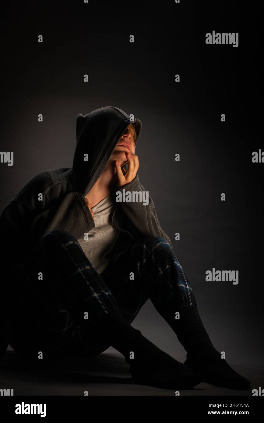 Broken boy is crying so much while hurting himself Stock Photo - Alamy