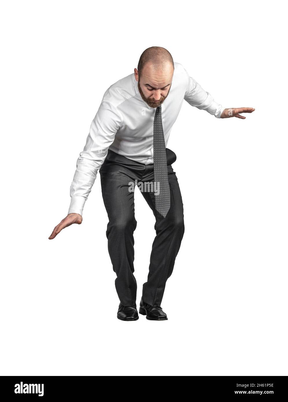 businessman trying to balance, look down. isolated on white Stock Photo ...