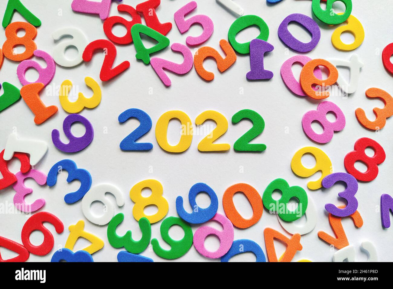 Numbers 2022 among scattered other digits in disarray on white ...