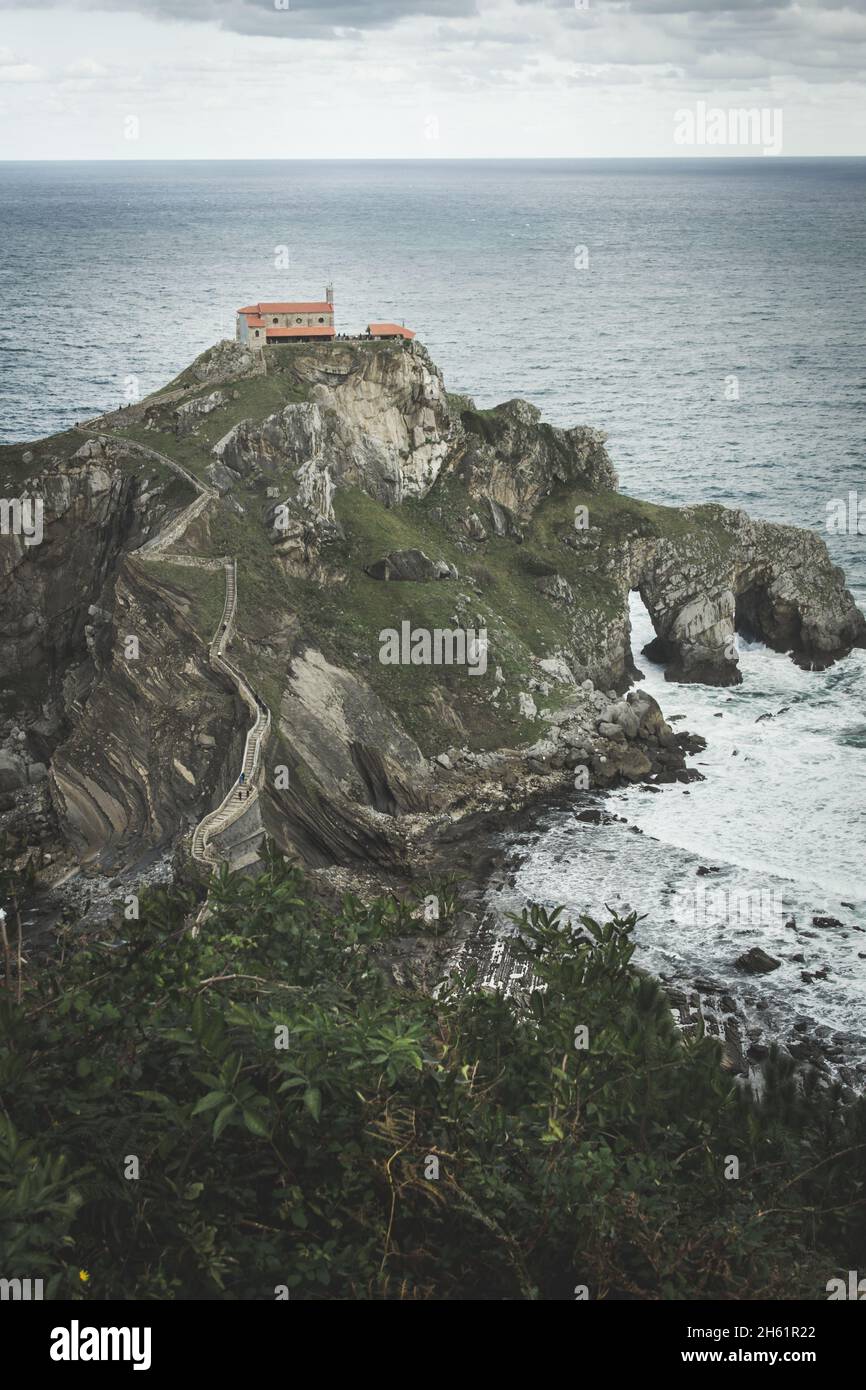 Dramatic landscape of San Juan de Gaztelugatxe chapel on cliff top by ...