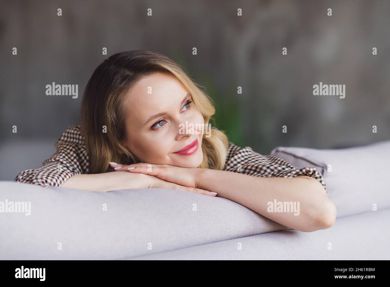 Photo portrait young woman smiling relaxing on sofa at home Stock Photo ...