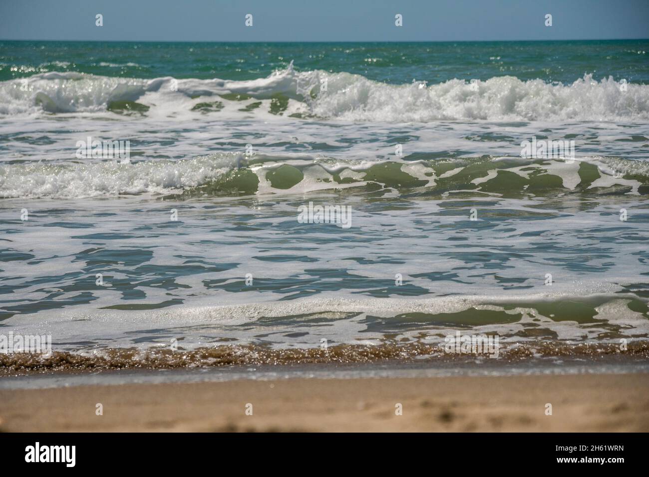 Sea with waves in the foreground on the shoreline Stock Photo - Alamy