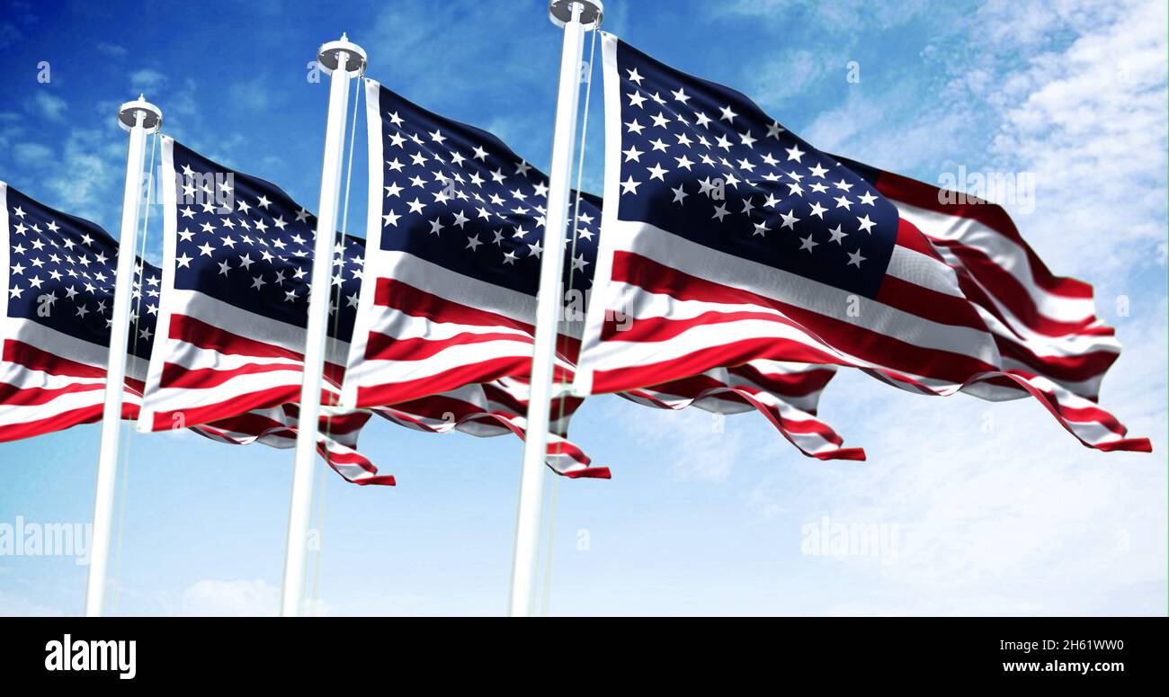 Four flags of the United States of America waving in the wind. Clear ...