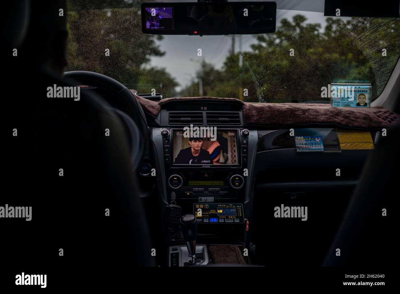 taxi ride with television in the car cockpit Stock Photo - Alamy