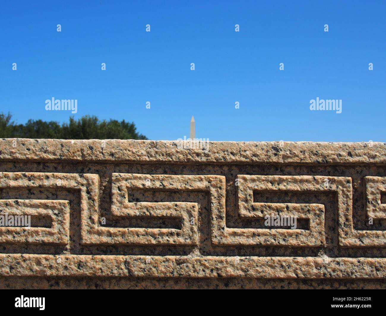 Greek key design detail on granite wall juxtaposed with Washington ...