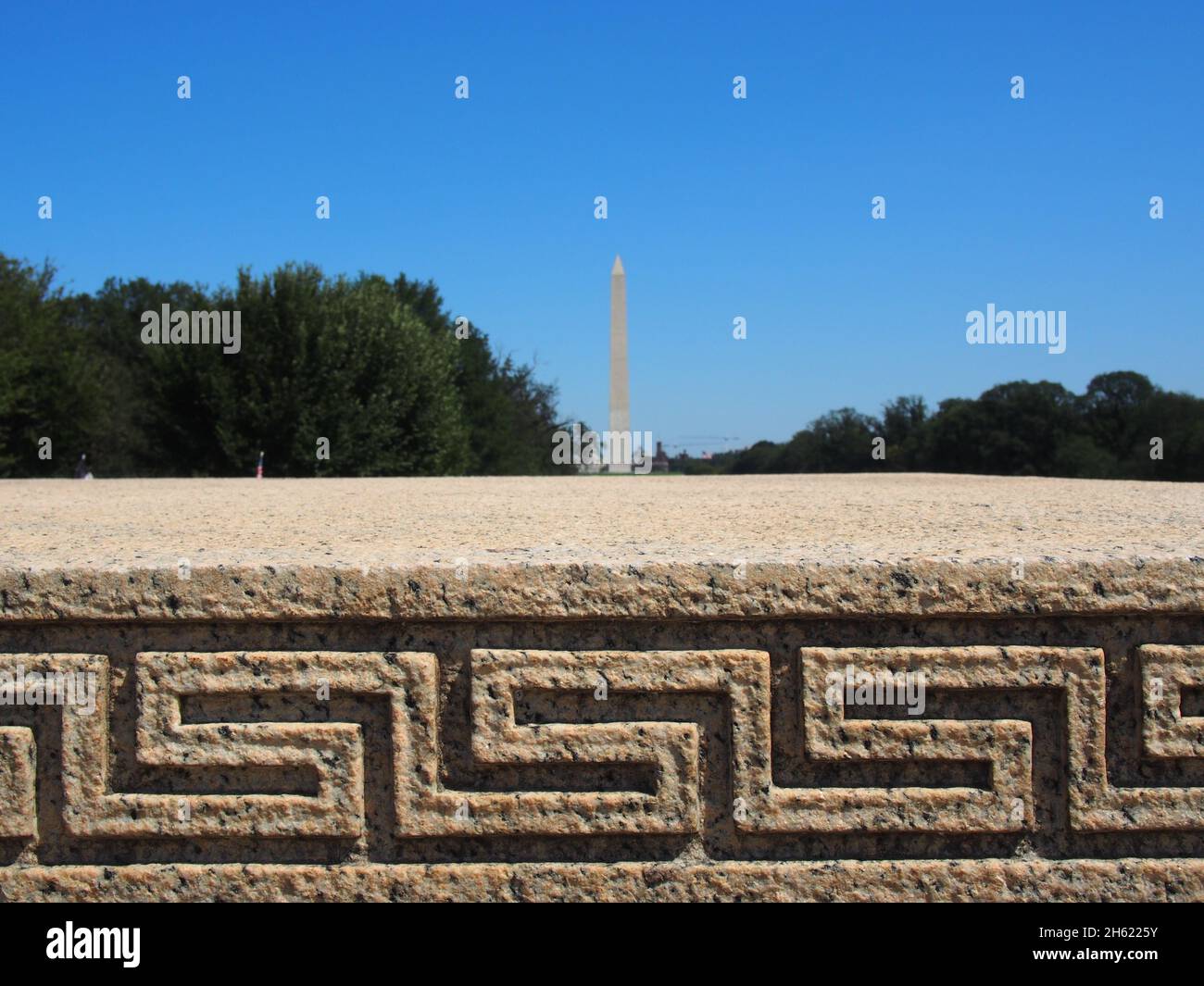 Greek key design detail on granite wall juxtaposed with Washington ...