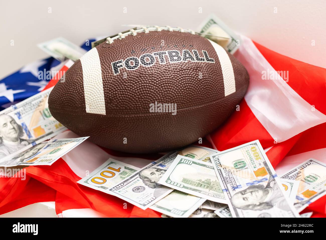 Money and rugby ball on american flag background, closeup. Concept of ...