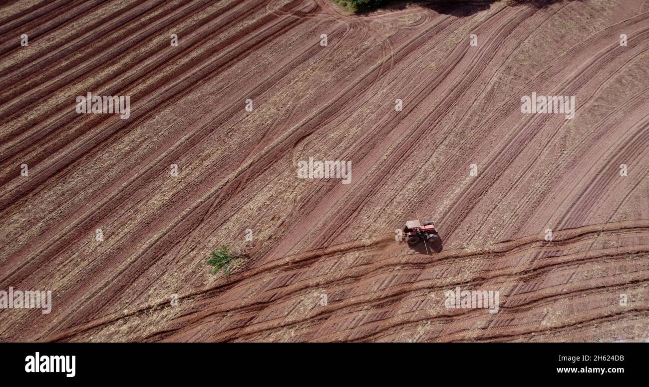 Farmer is using farming machinery for planting process, Brazilian farm ...