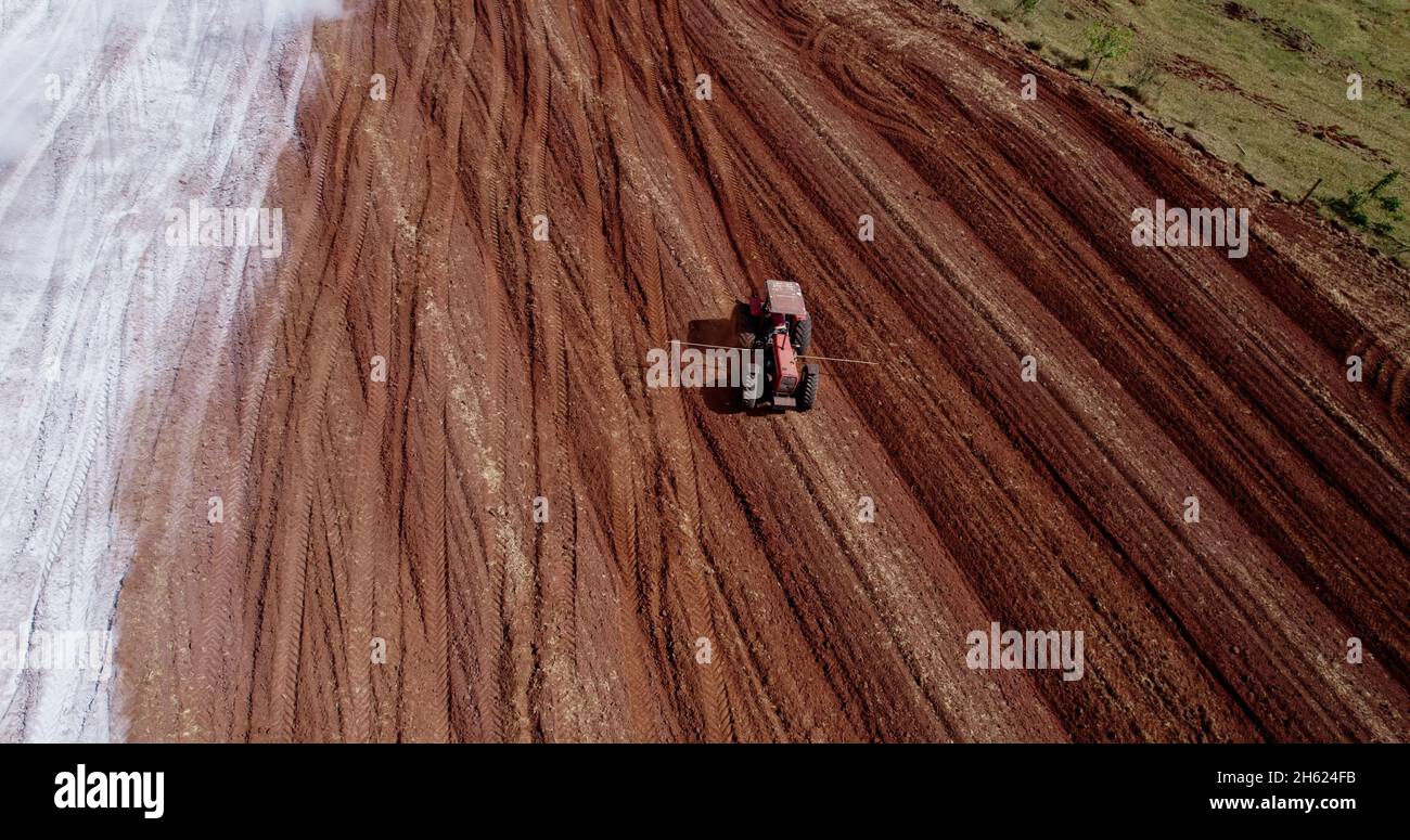 Farmer is using farming machinery for planting process, Brazilian farm ...
