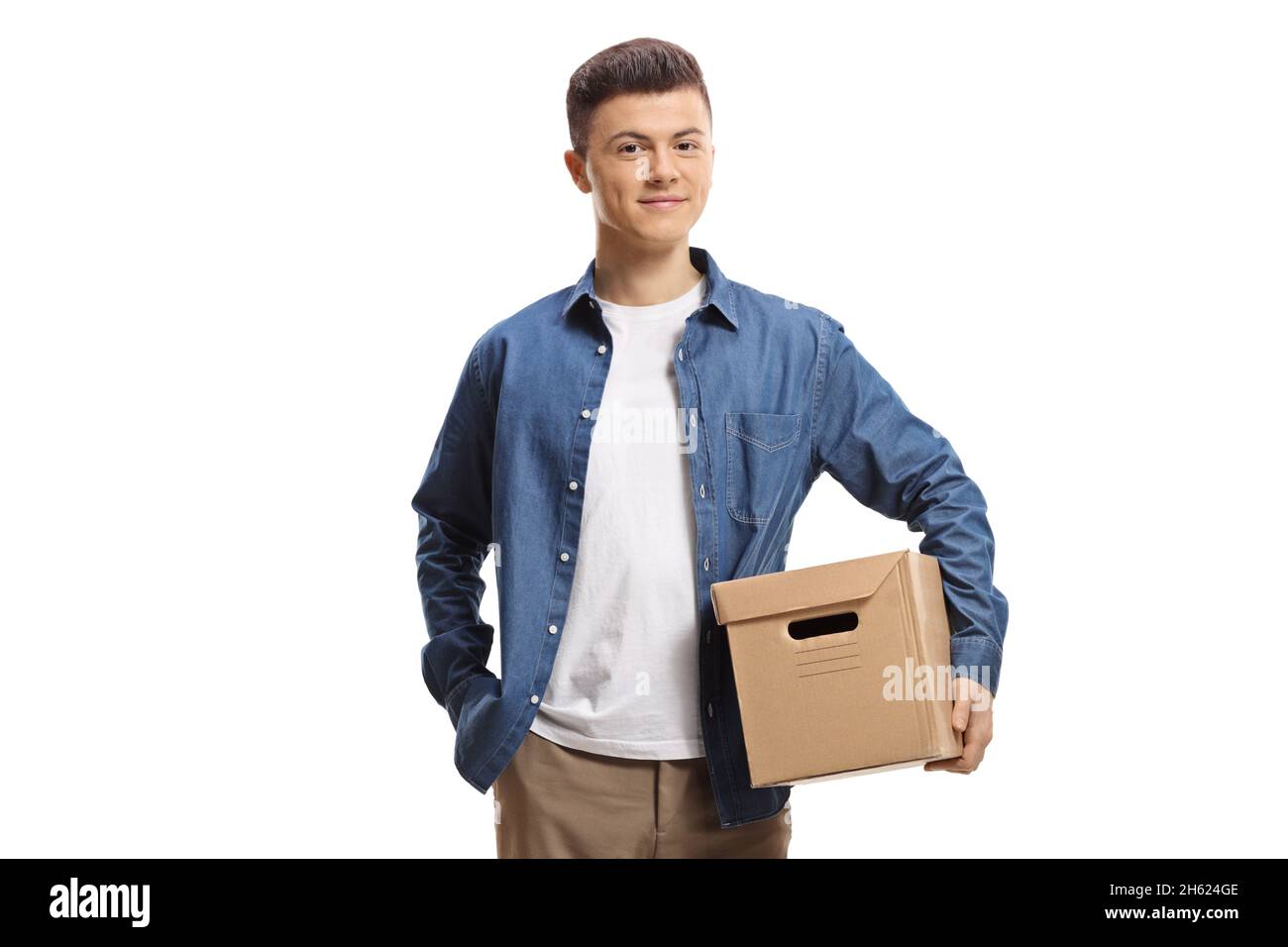 Guy standing with a cardboard box under arm isolated on white ...