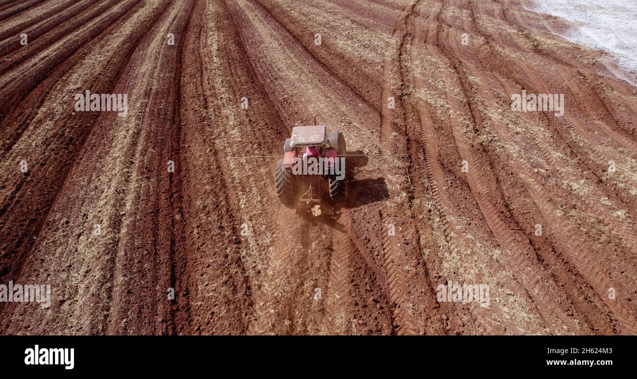 Farmer is using farming machinery for planting process, Brazilian farm ...