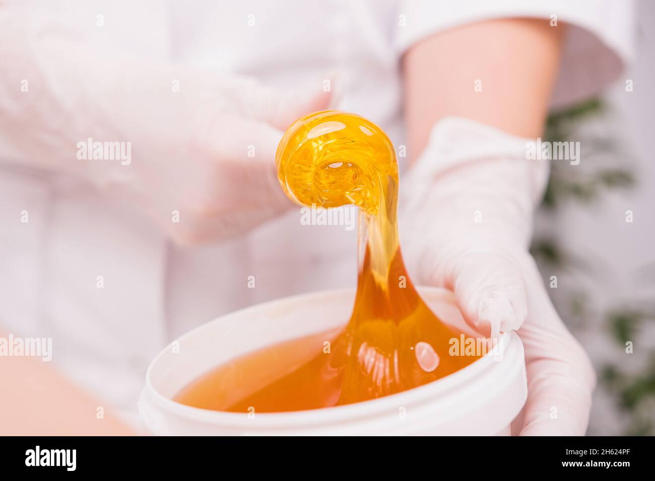 Close up photo of a sugar paste for depilation hair removal procedure ...