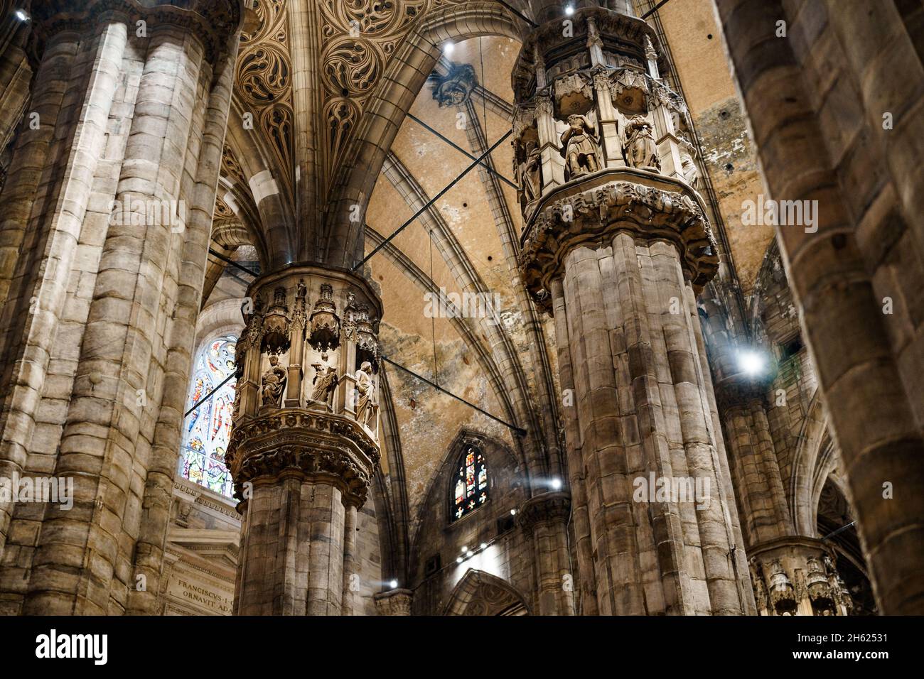High carved columns under the vaulted ceiling in the Duomo. Italy ...