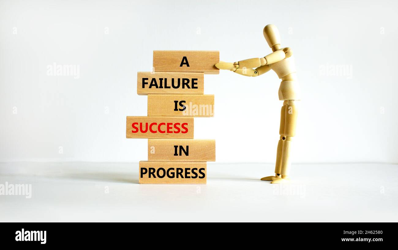 Failure or success symbol. Wooden blocks with words A failure is ...