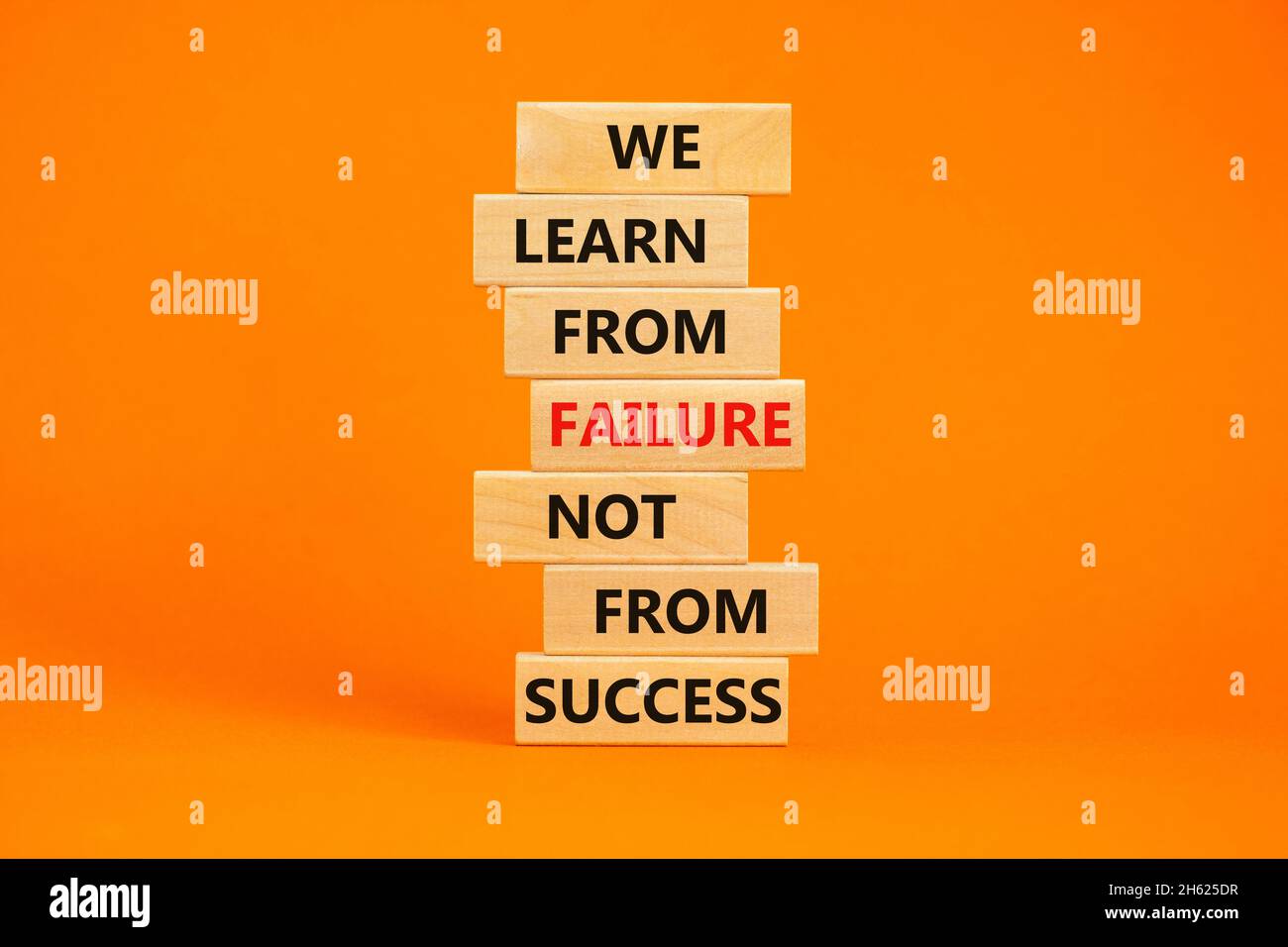 Failure or success symbol. Wooden blocks with words We learn from ...