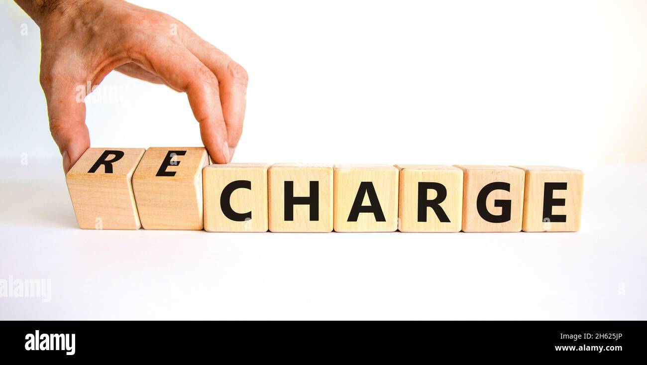 Charge or recharge symbol. Businessman turns wooden cubes and changes ...