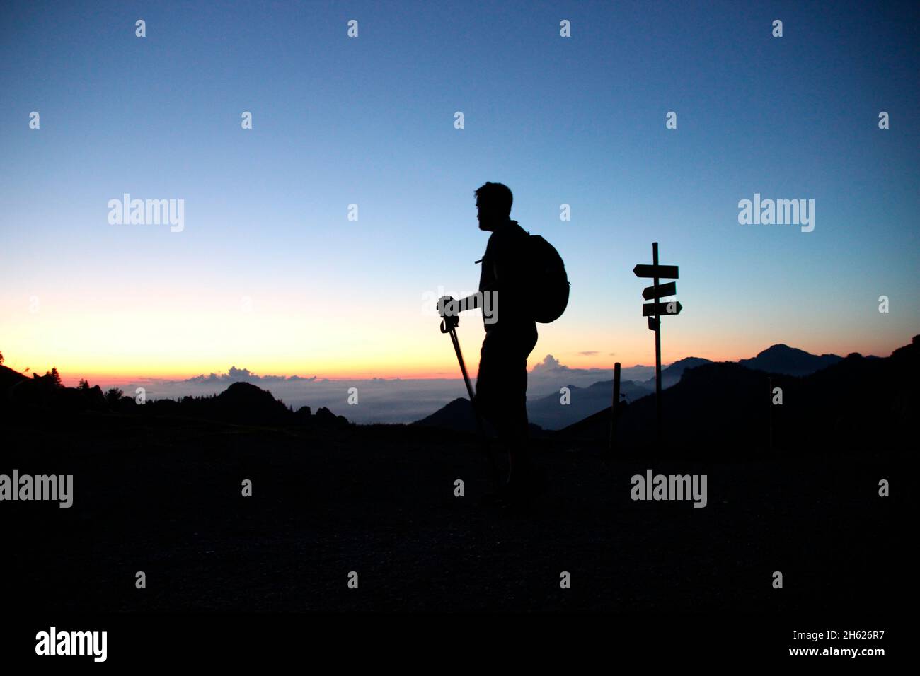 silhouette of hikers on hike to the summit of the kampenwand (1669 m ...