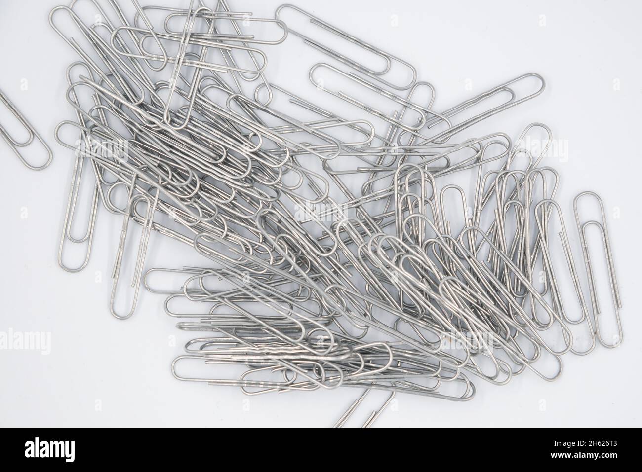 Paper clips on white background Stock Photo - Alamy