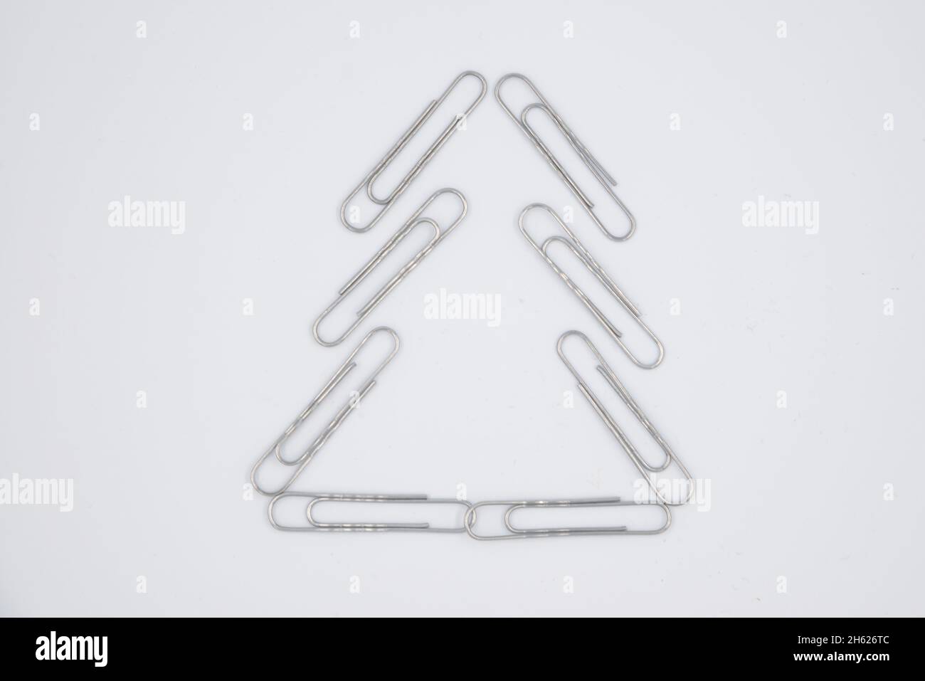 Fir tree made of paper clips - isolated on white background Stock Photo ...