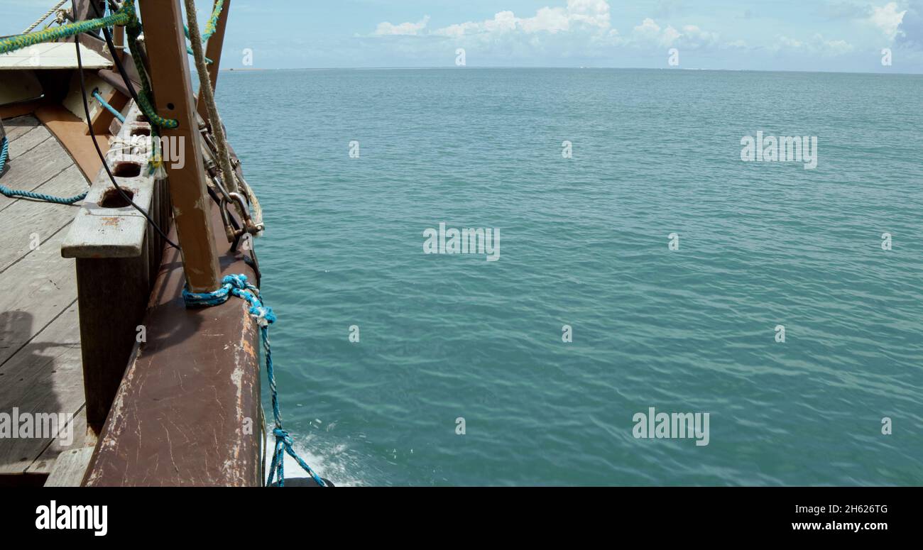 Side view of boat sailing Stock Photo - Alamy