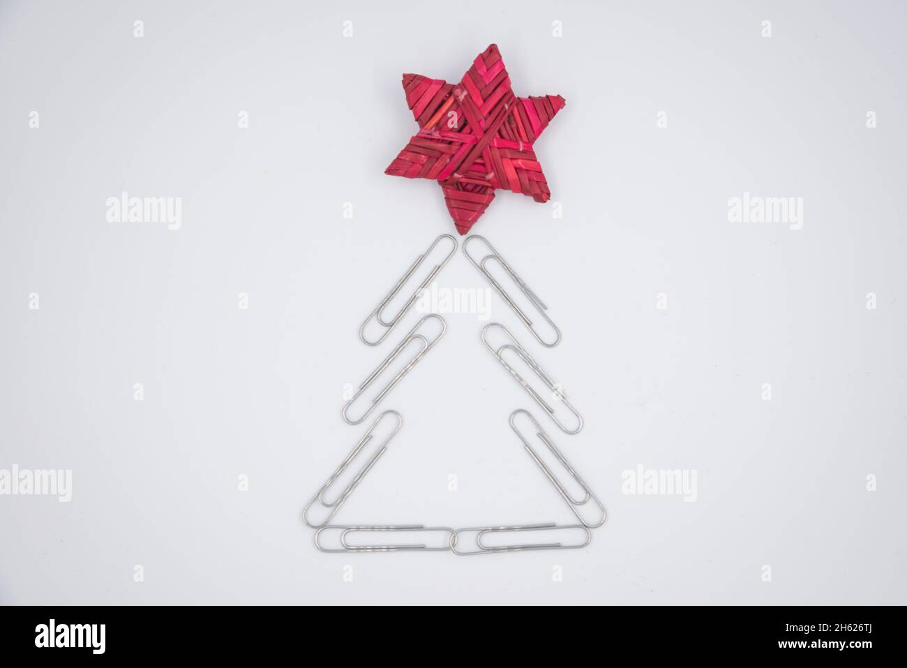 Fir tree made of paper clips - isolated on white background Stock Photo ...