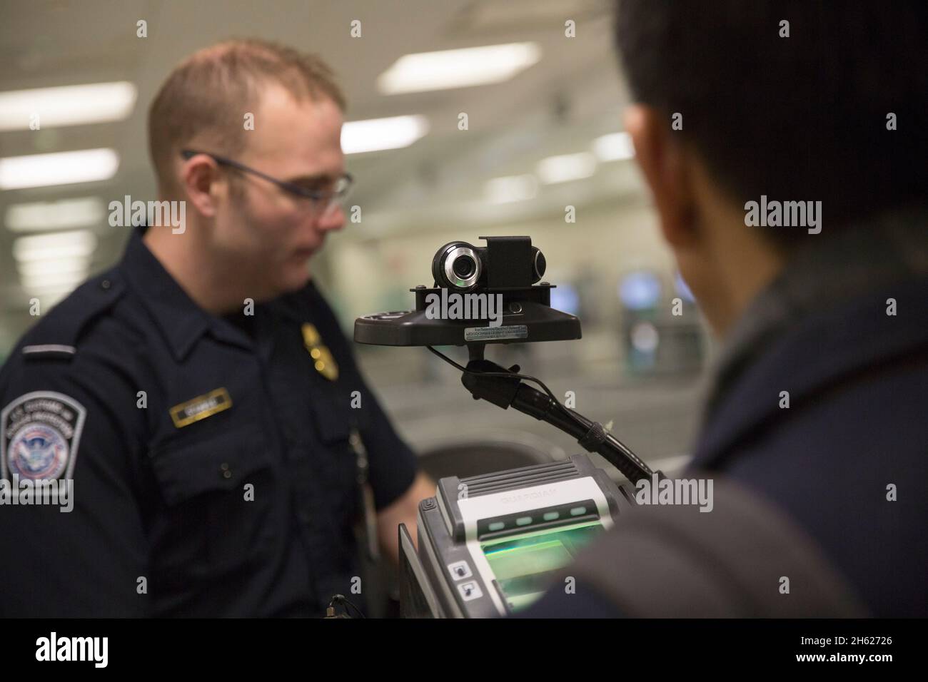 U.S. Customs and Border Protection officers screen international ...
